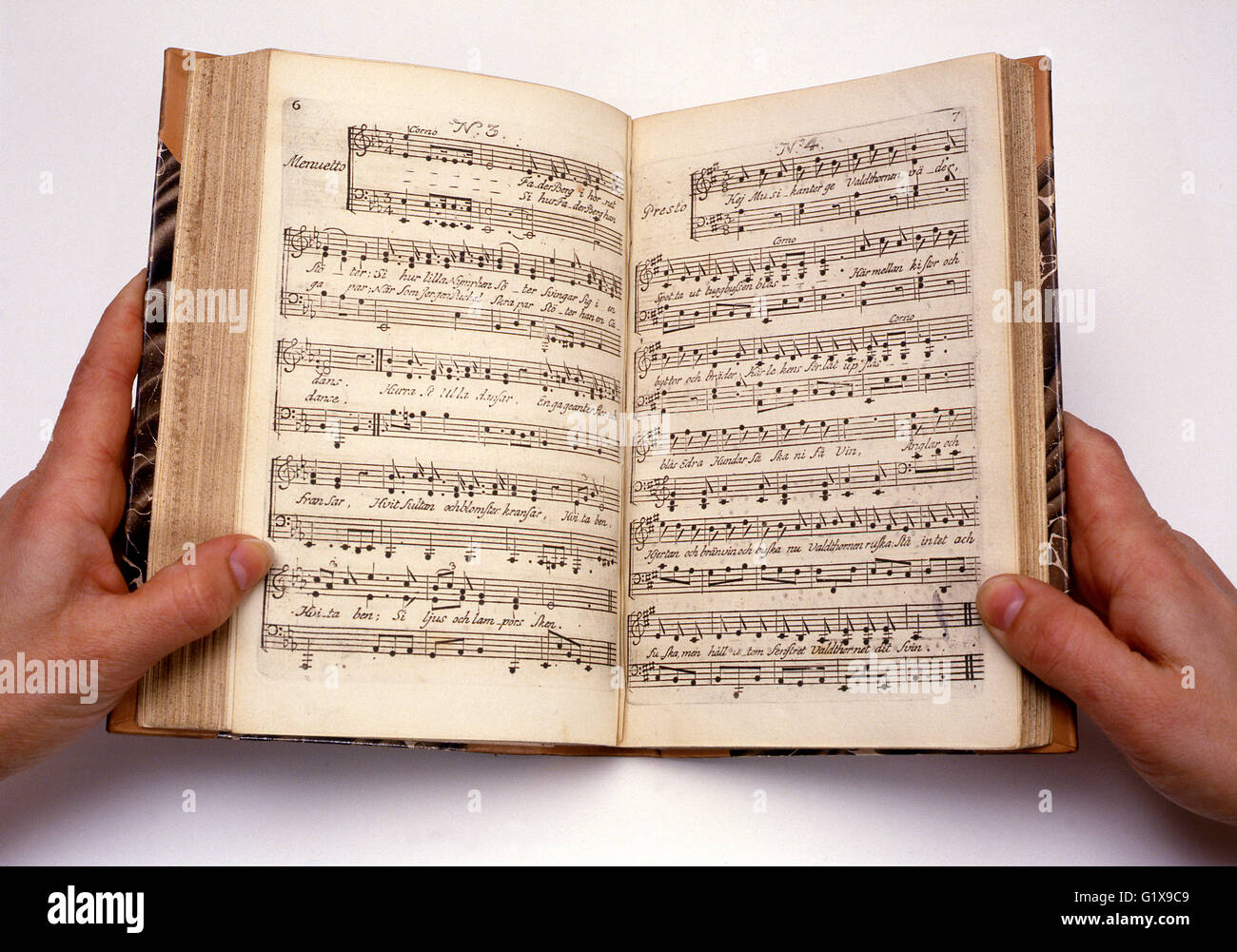 Hands holds a songbook Stock Photo - Alamy