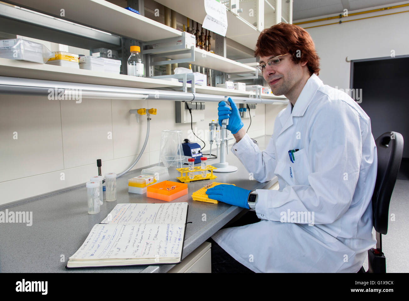 Scientists during his research in the laboratory Stock Photo - Alamy