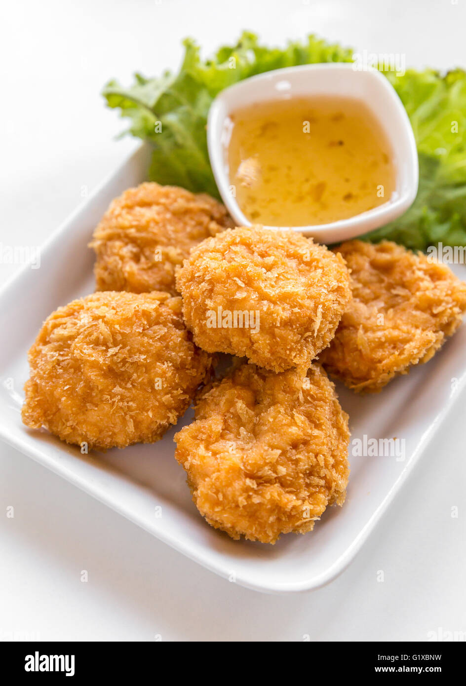 deep-fried shrimp cakes with sweet sauce on white background Stock ...
