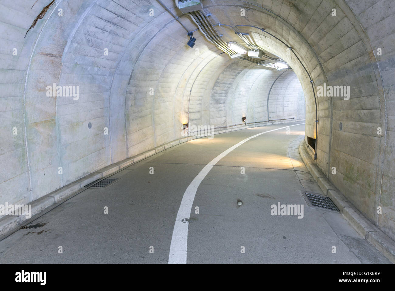 Interior of an urban walkway tunnel road Stock Photo - Alamy
