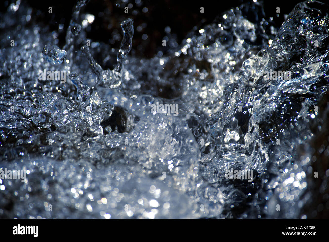 Water flowing in stream splashing hi-res stock photography and images ...