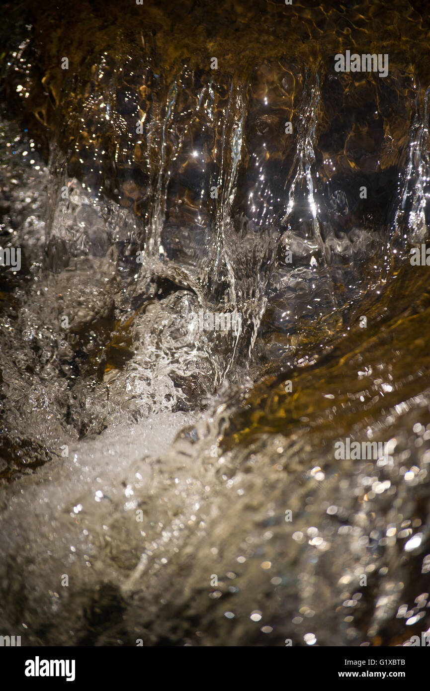Water flowing in stream splashing hi-res stock photography and images ...