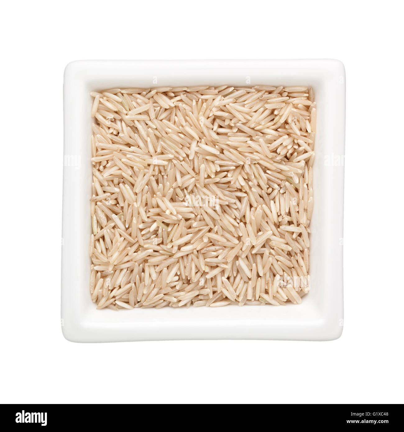 Brown basmati rice in a square bowl isolated on white background Stock ...