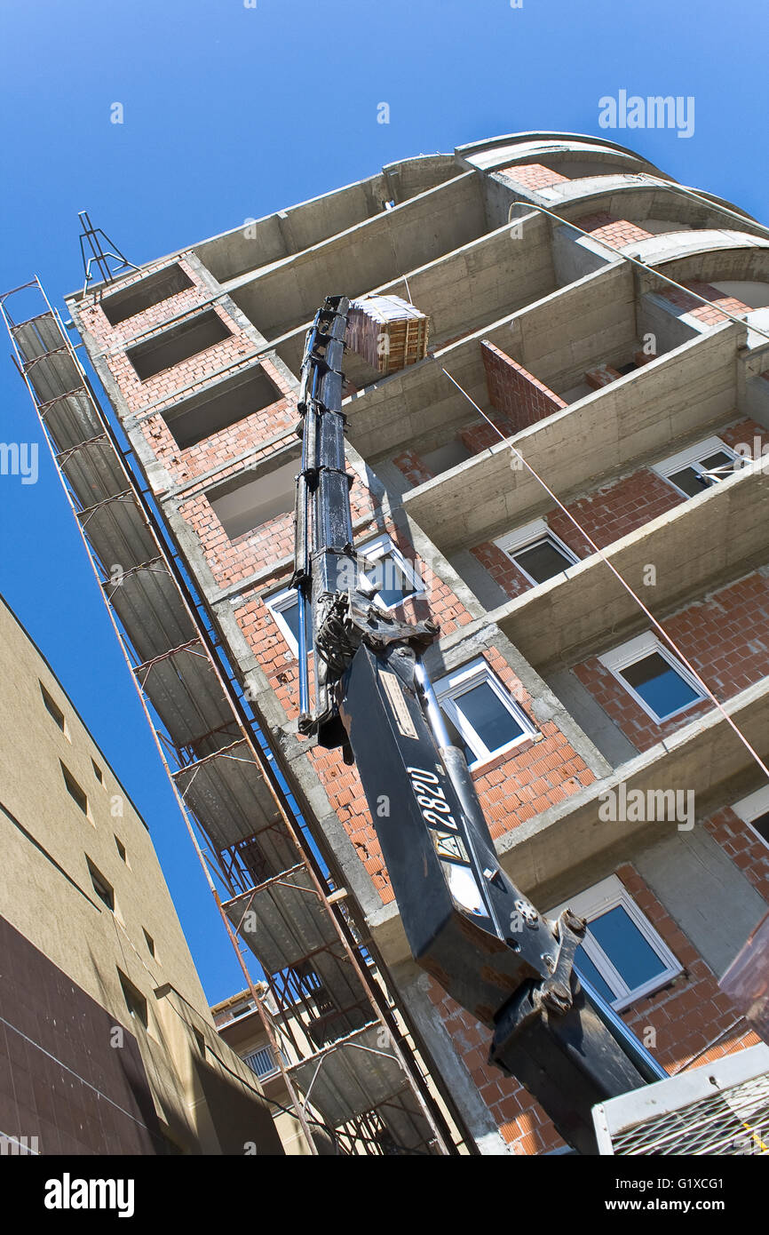 Crane lifting bricks hi-res stock photography and images - Alamy