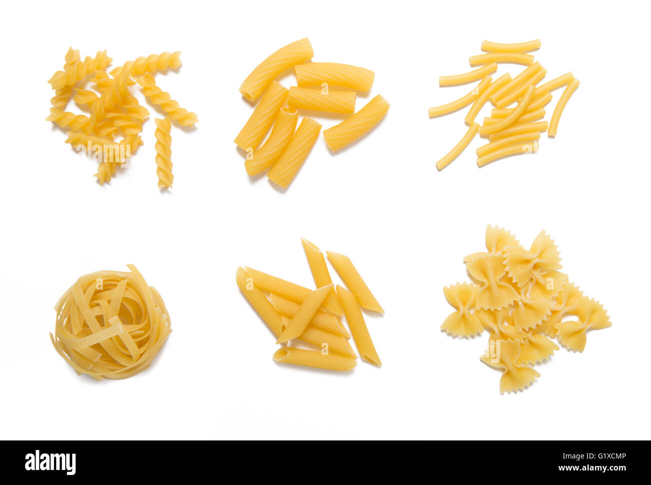 pasta uncooked, isolated on white background Stock Photo - Alamy