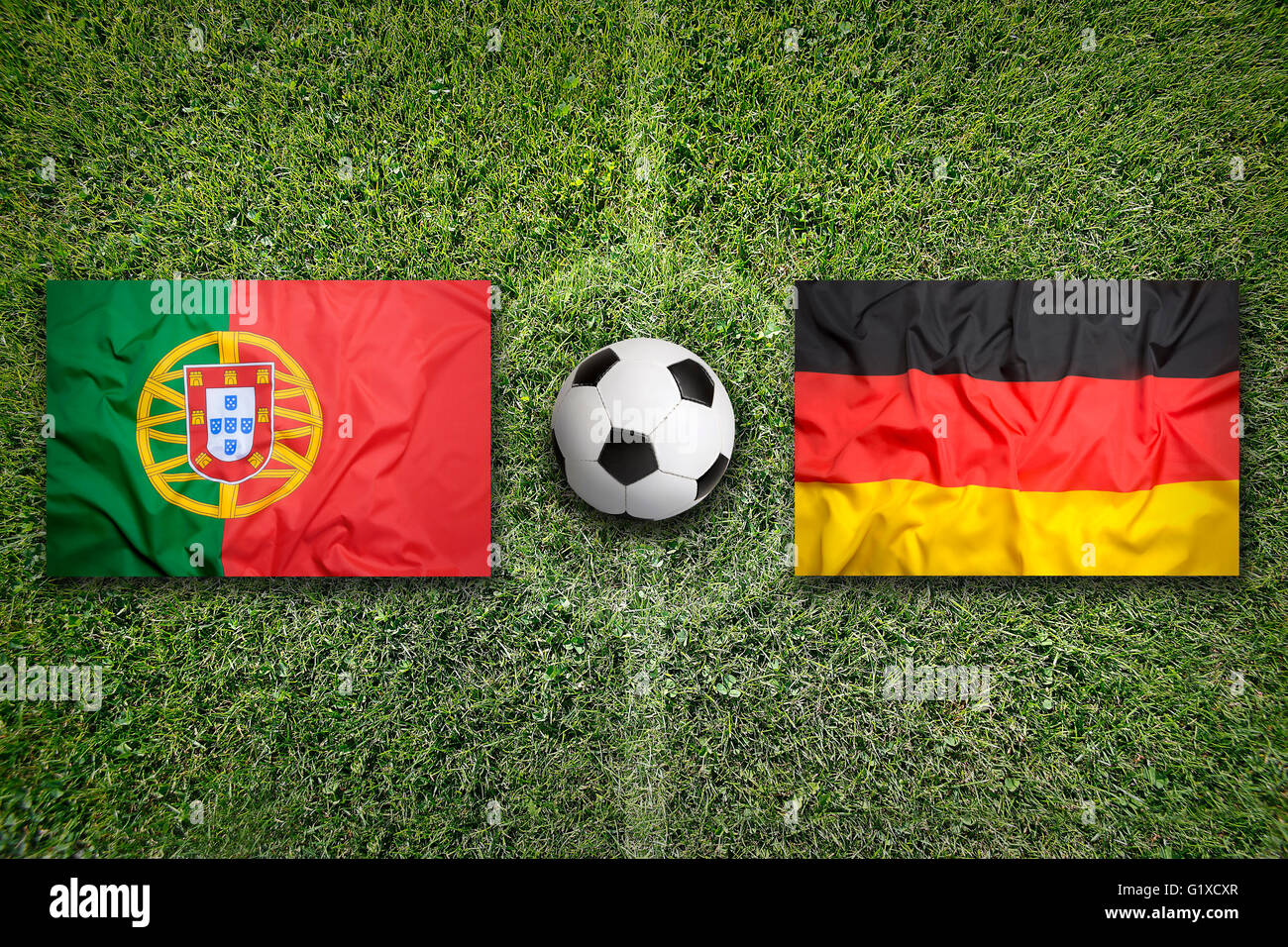 Portugal vs. Germany flags on a green soccer field Stock Photo - Alamy