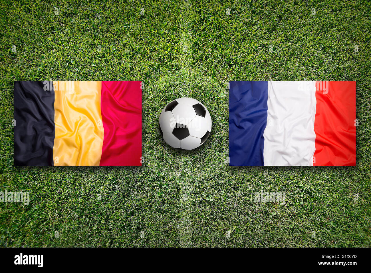 Belgium vs. France flags on a green soccer field Stock Photo - Alamy