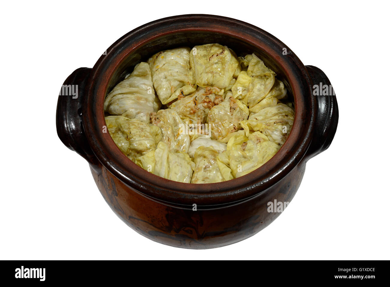Stuffed cabbage leaves in a pot on a white background Stock Photo - Alamy