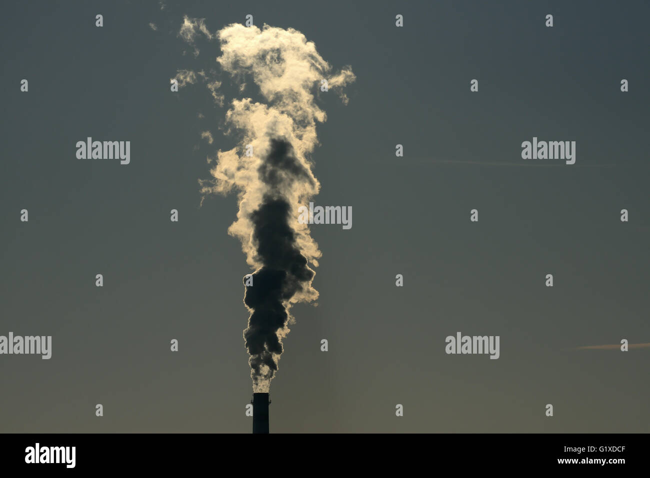 Chimney pollutes the air.Chimney with dense smoke Stock Photo - Alamy