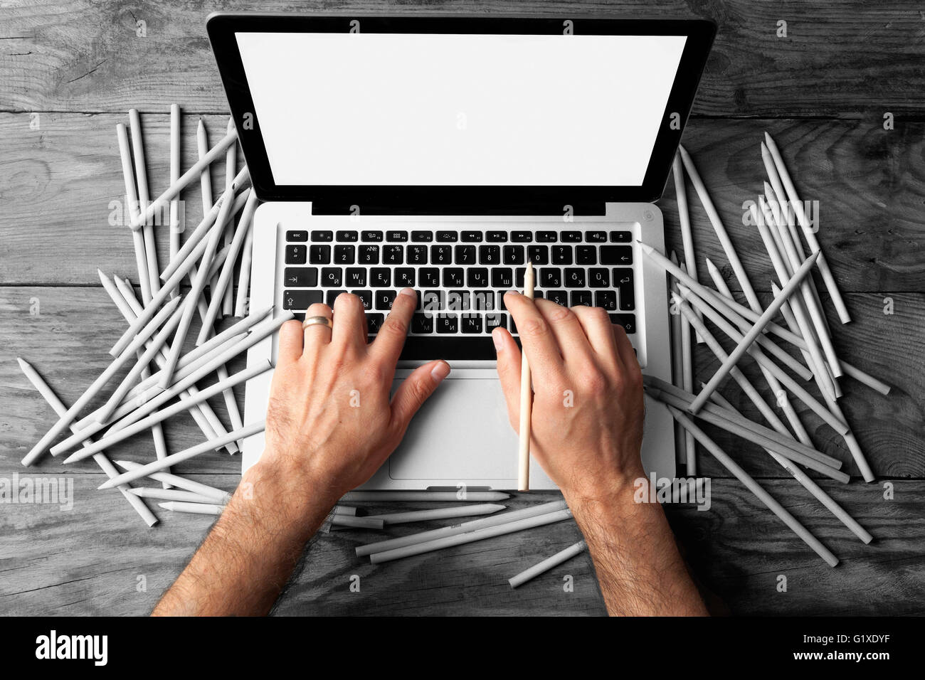 male graphic designer working on laptop Stock Photo - Alamy