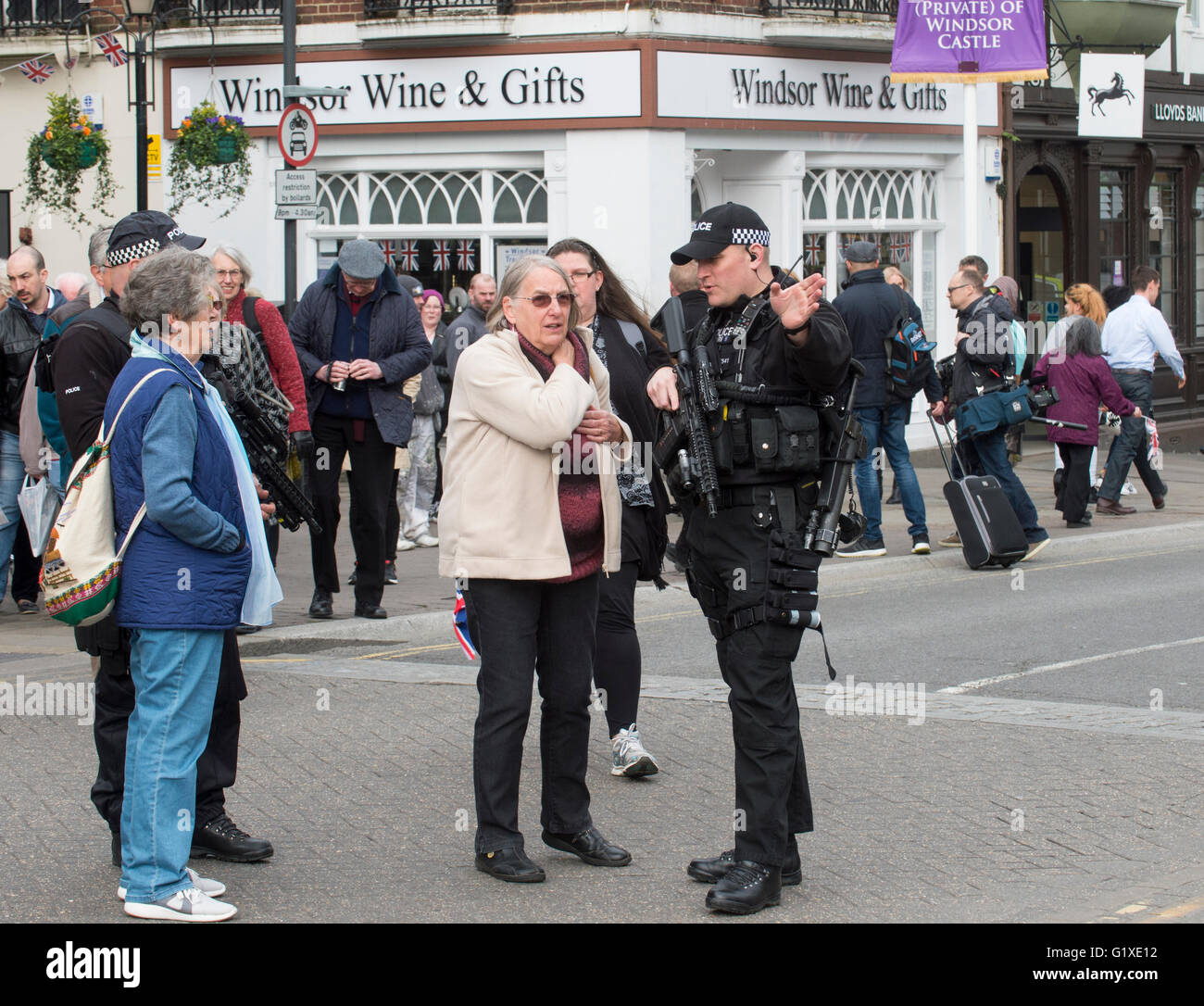 Armed British police officers secure the streets of Windsor for the ...