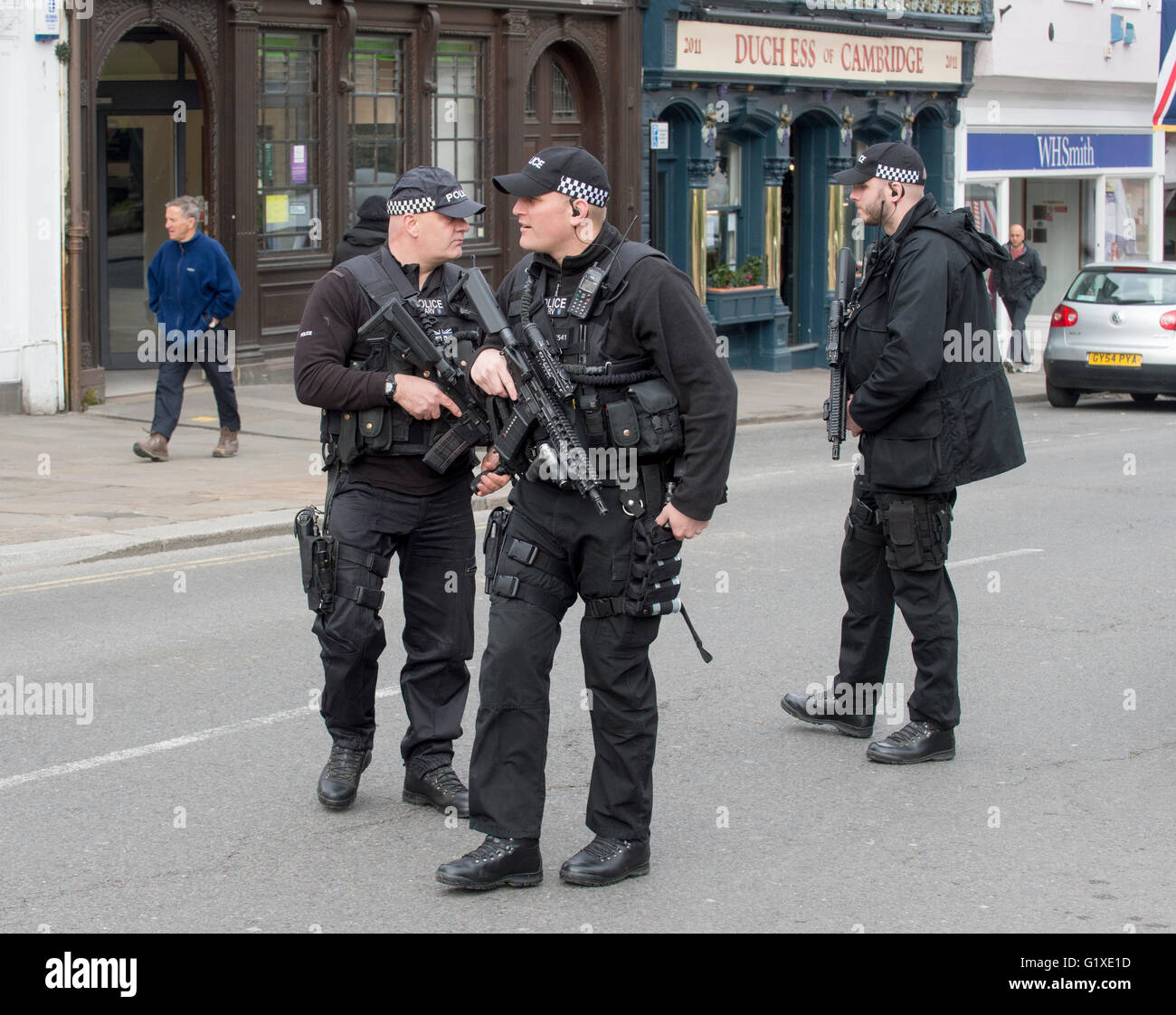 Armed British police officers secure the streets of Windsor for the ...