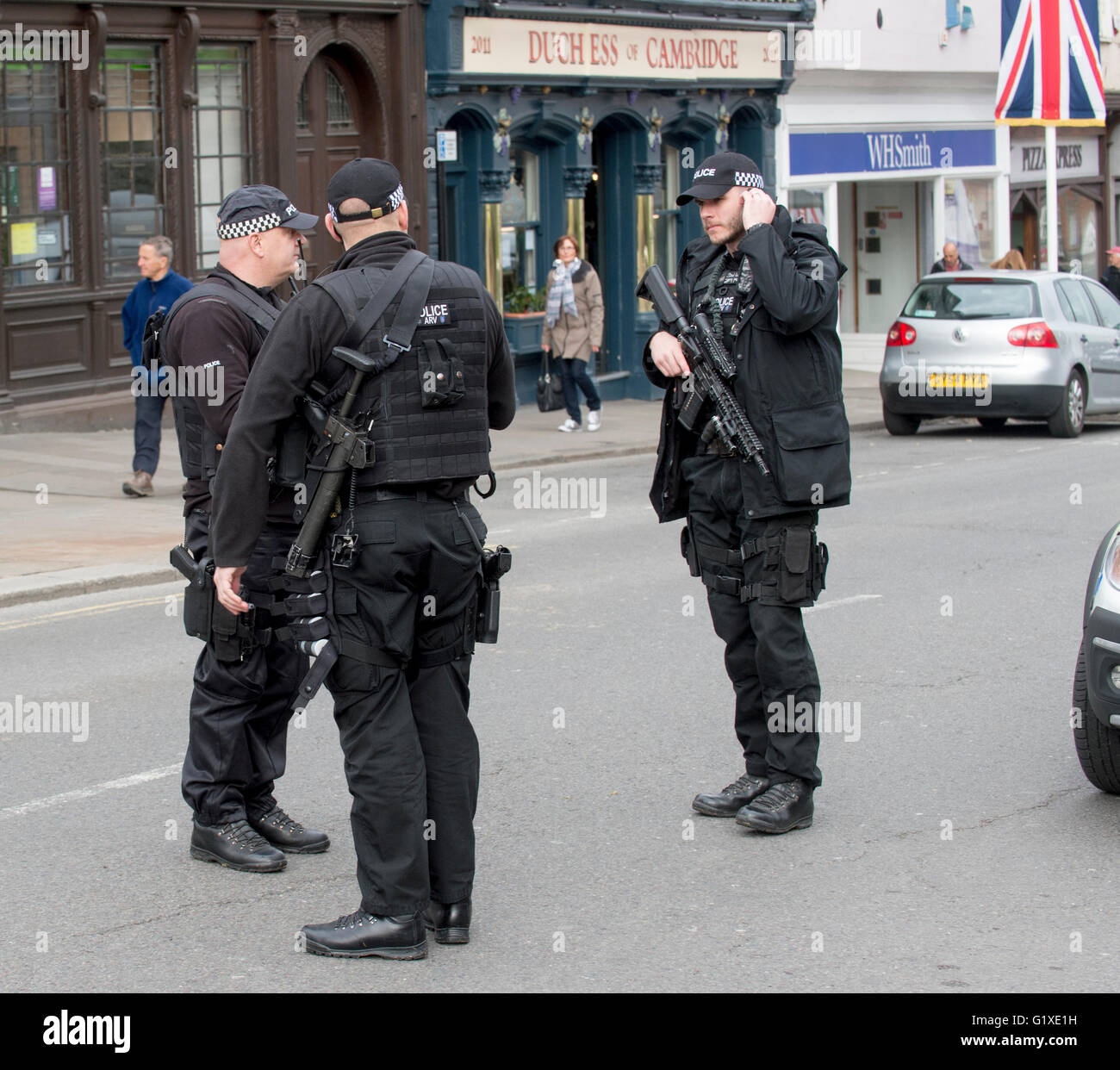 Armed British police officers secure the streets of Windsor for the ...
