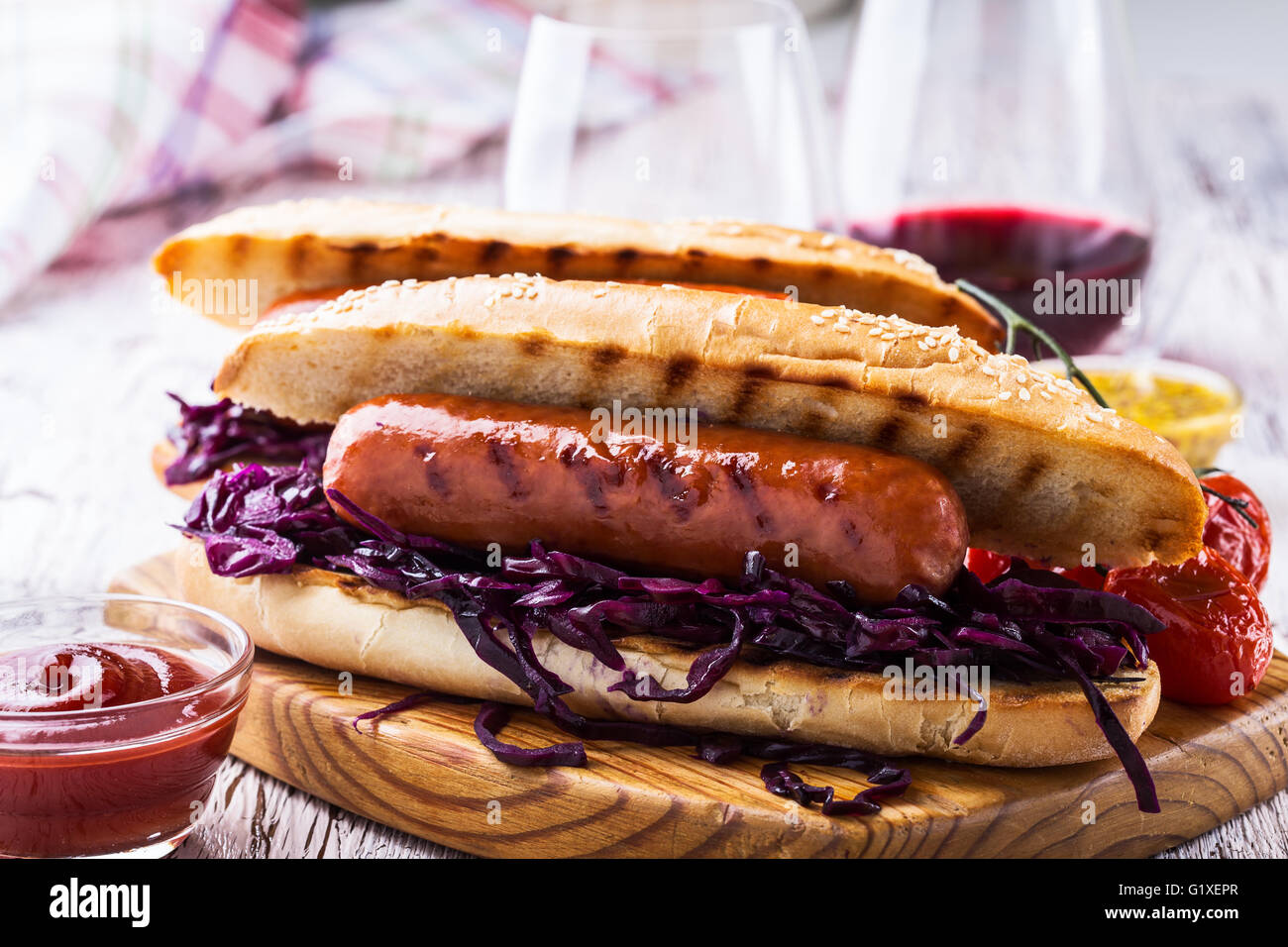 Grilled sausage sandwich with sweet red cabbage coleslaw, mustard and ...