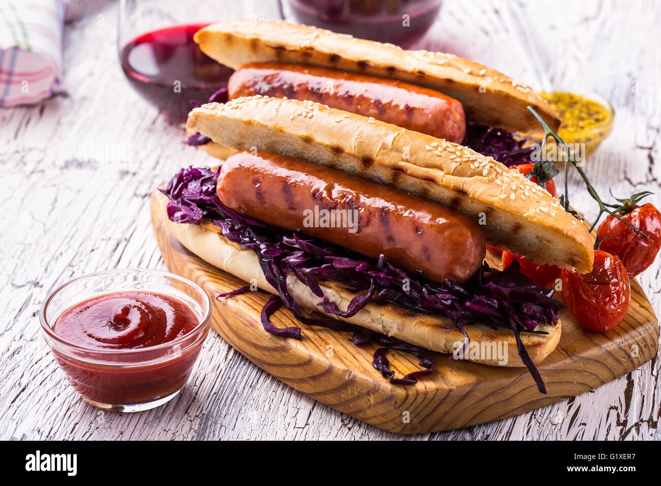 Grilled sausage sandwich with sweet red cabbage coleslaw, mustard and ...