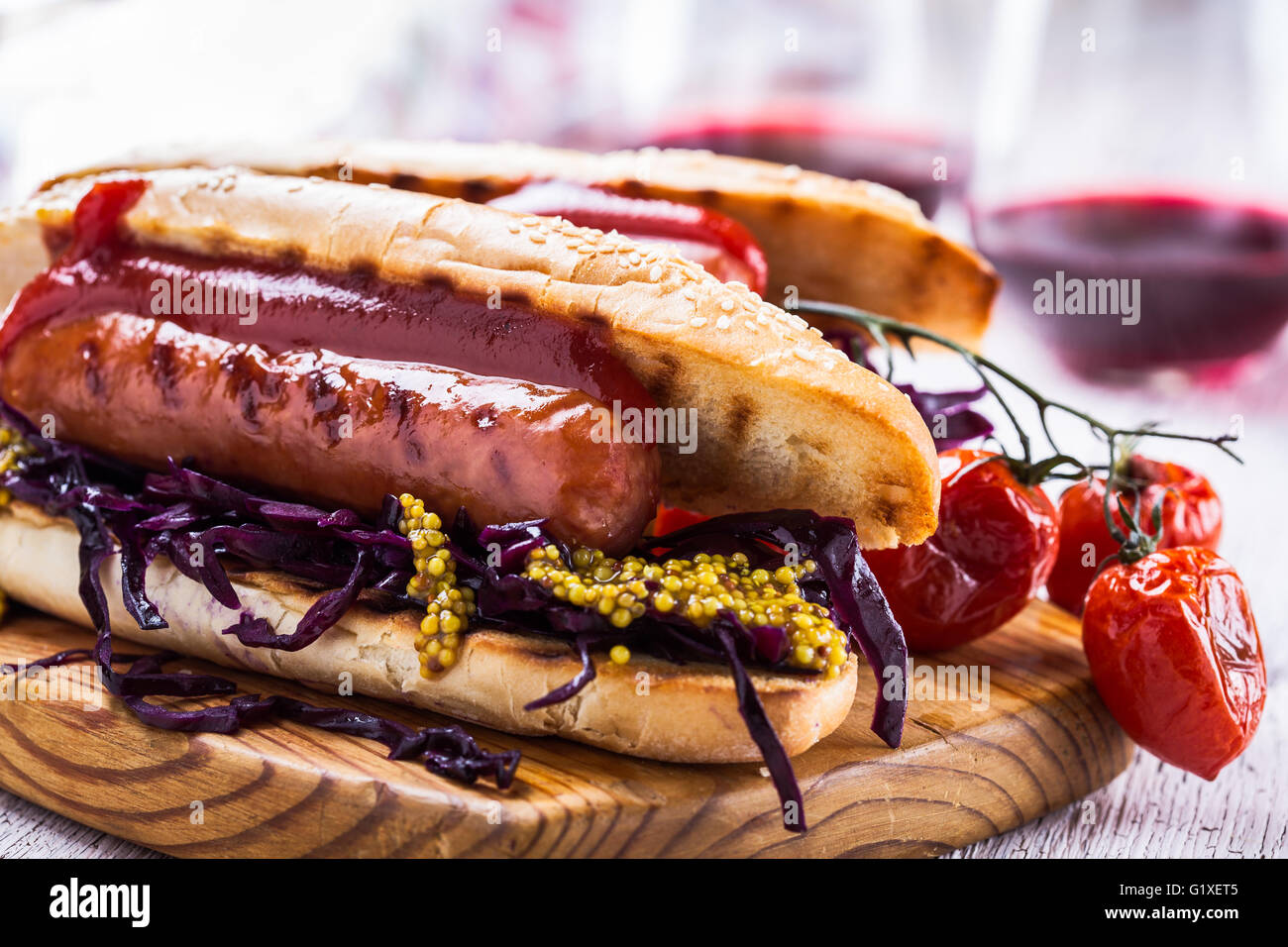 Grilled sausage sandwich with sweet red cabbage coleslaw, mustard and ...