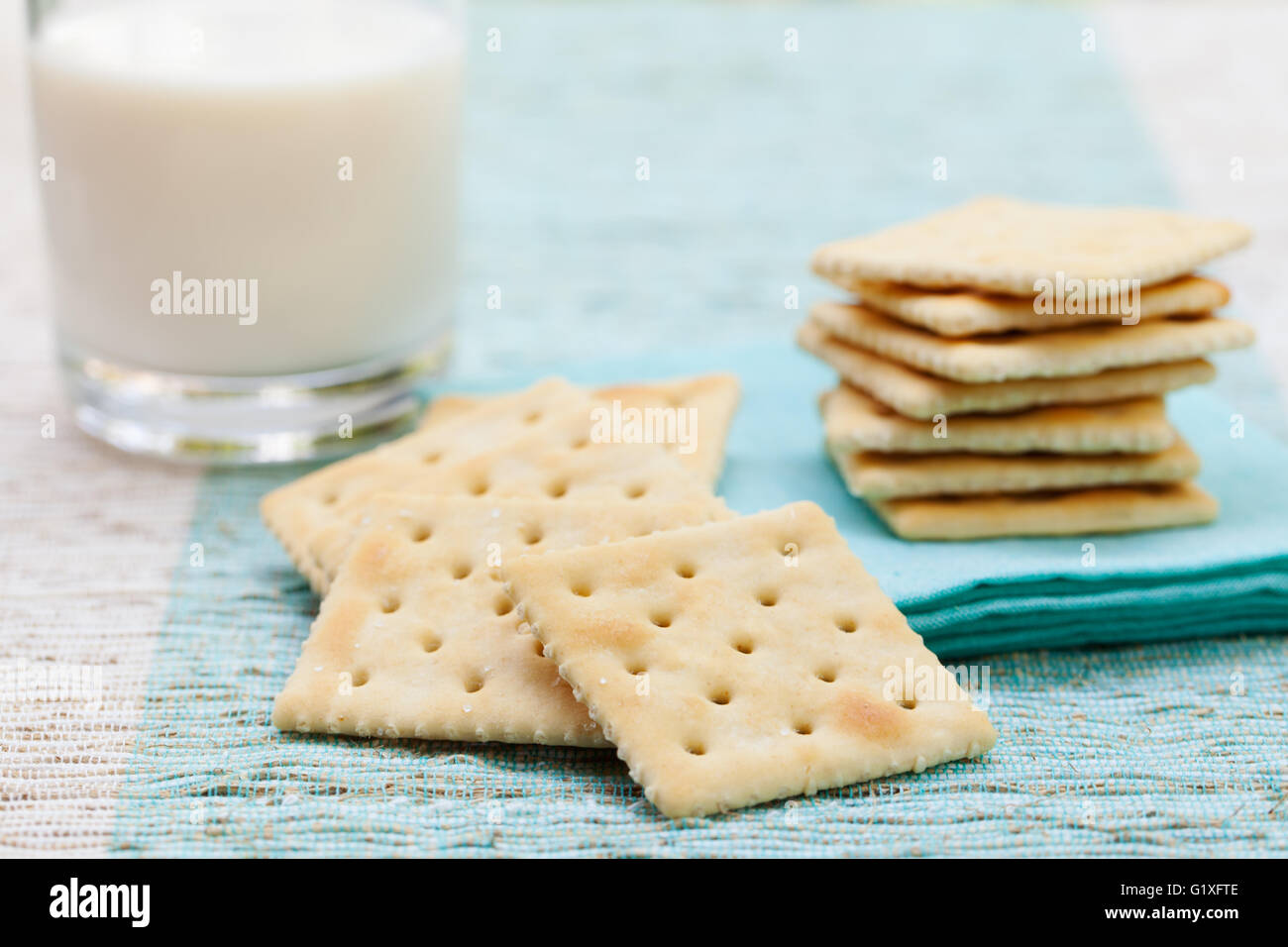 Square biscuit cracker with fresh milk in glass Stock Photo - Alamy