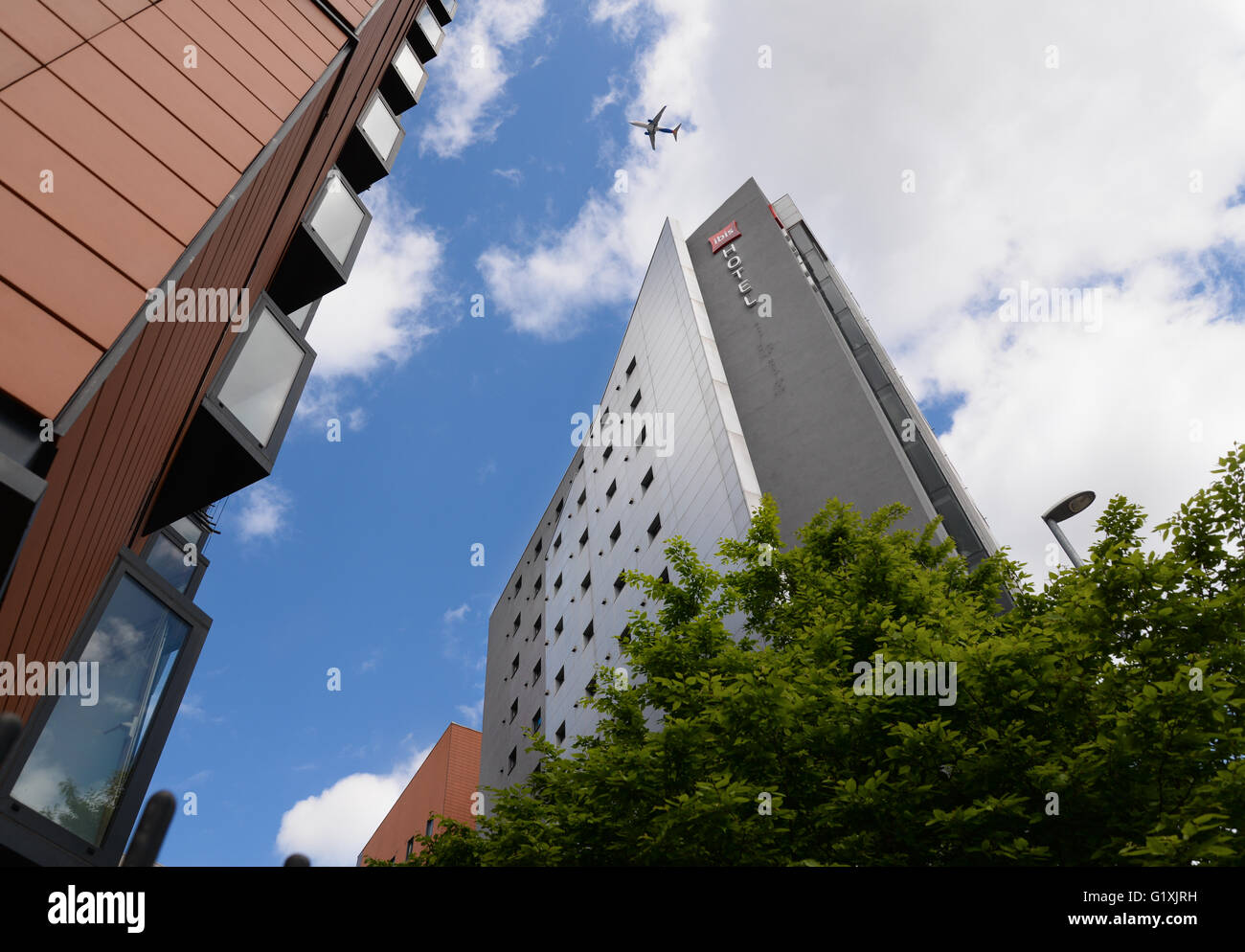 ibis Leeds Centre hotel in the north of England with a airliner above ...