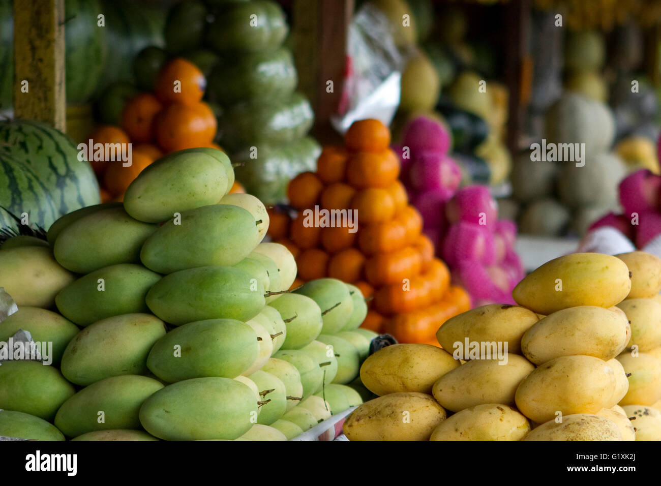 Green an yellow Mango's at the forefront of this fruit stall in Cebu ...