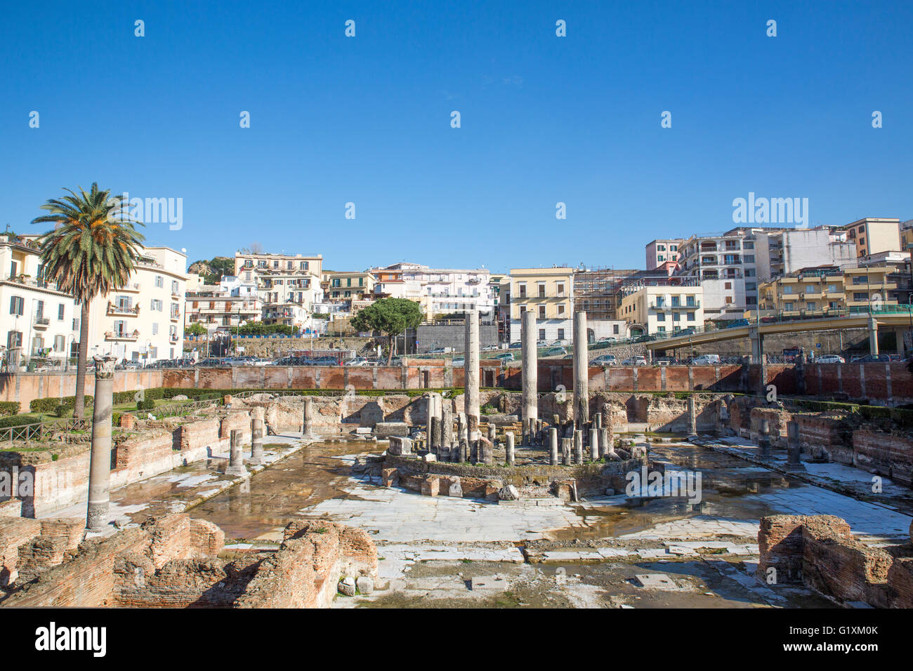 View of ancient roman ruins in the seafront of Pozzuoli, Napoli, Naples ...