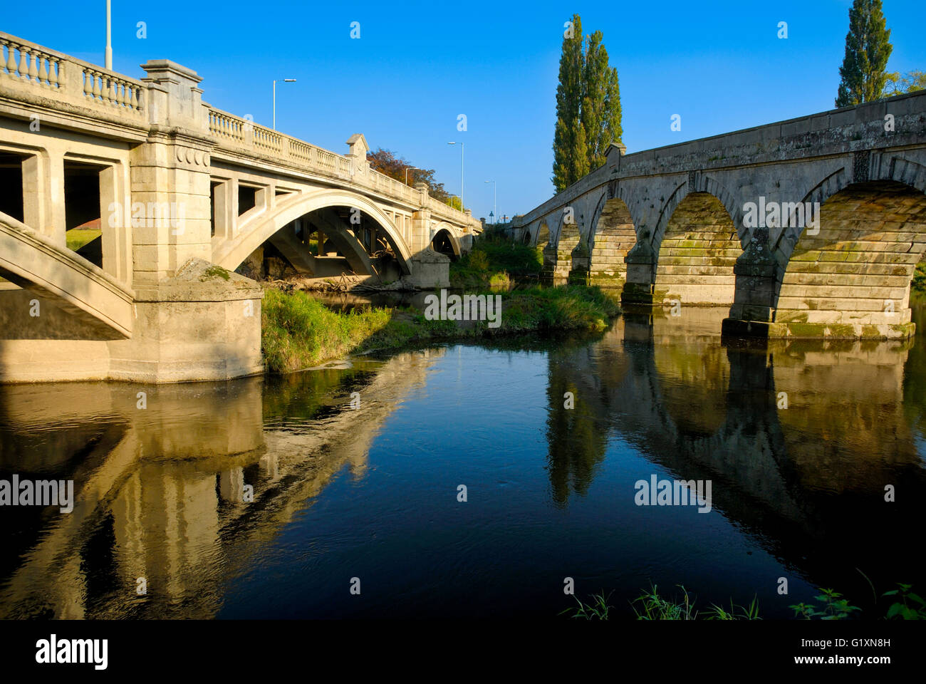 Old and modern road bridges over the River Severn at Atcham, Shropshire ...