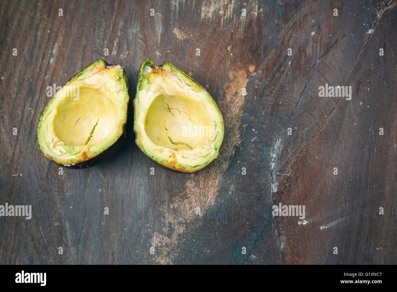 Slice of sweet Avocado on the top of old wooden in natural light Stock ...
