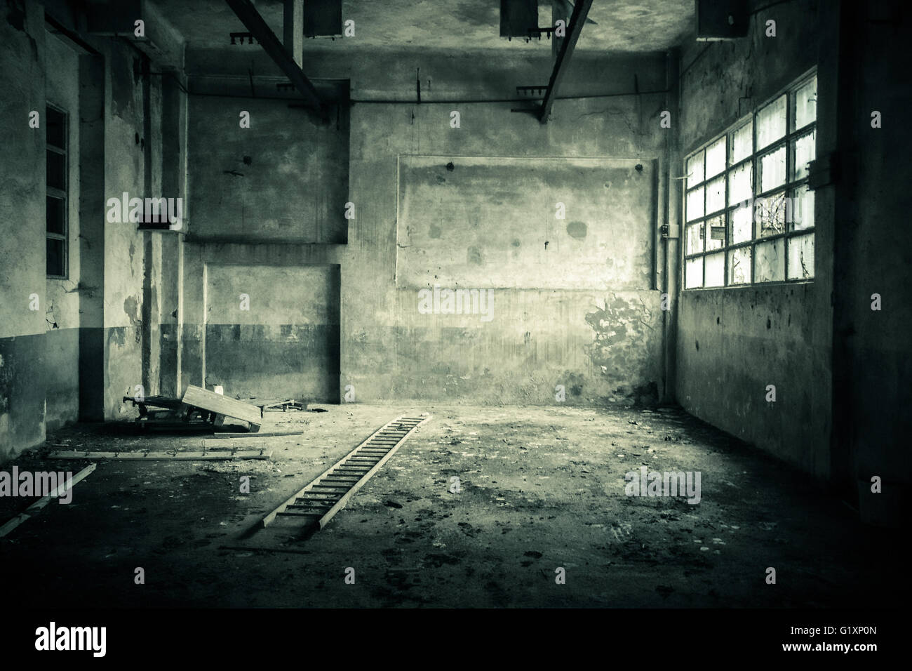 Abandoned room with broken window Stock Photo - Alamy