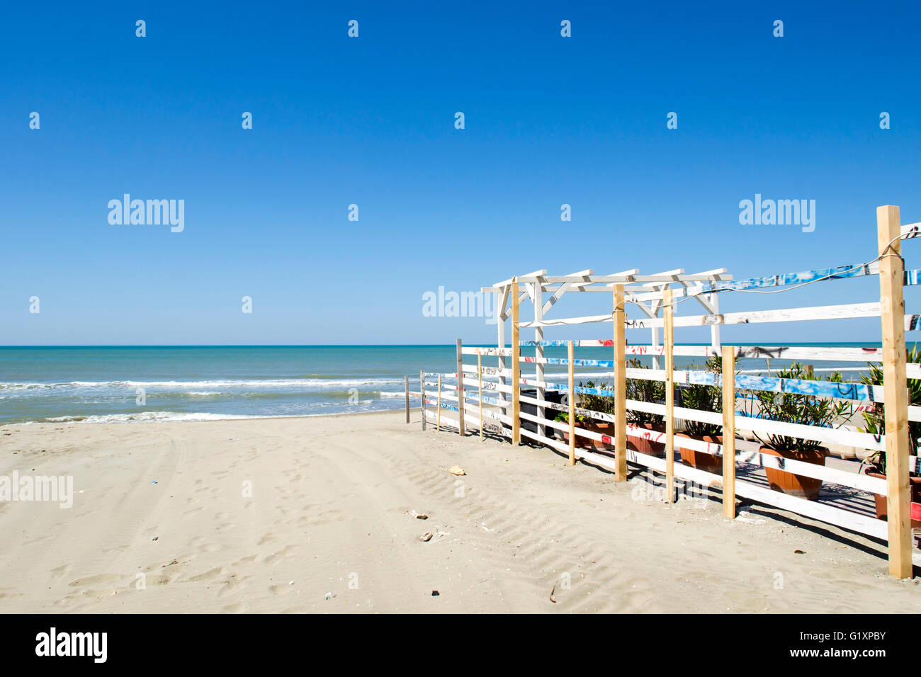 Beach and blue sky, wooden fence Stock Photo - Alamy