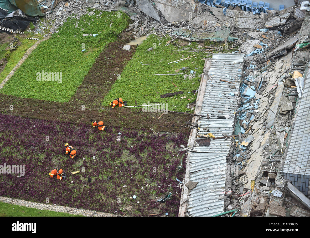 Hong Kong. 20th May, 2016. Rescuers work at a rooftop collapse site in ...