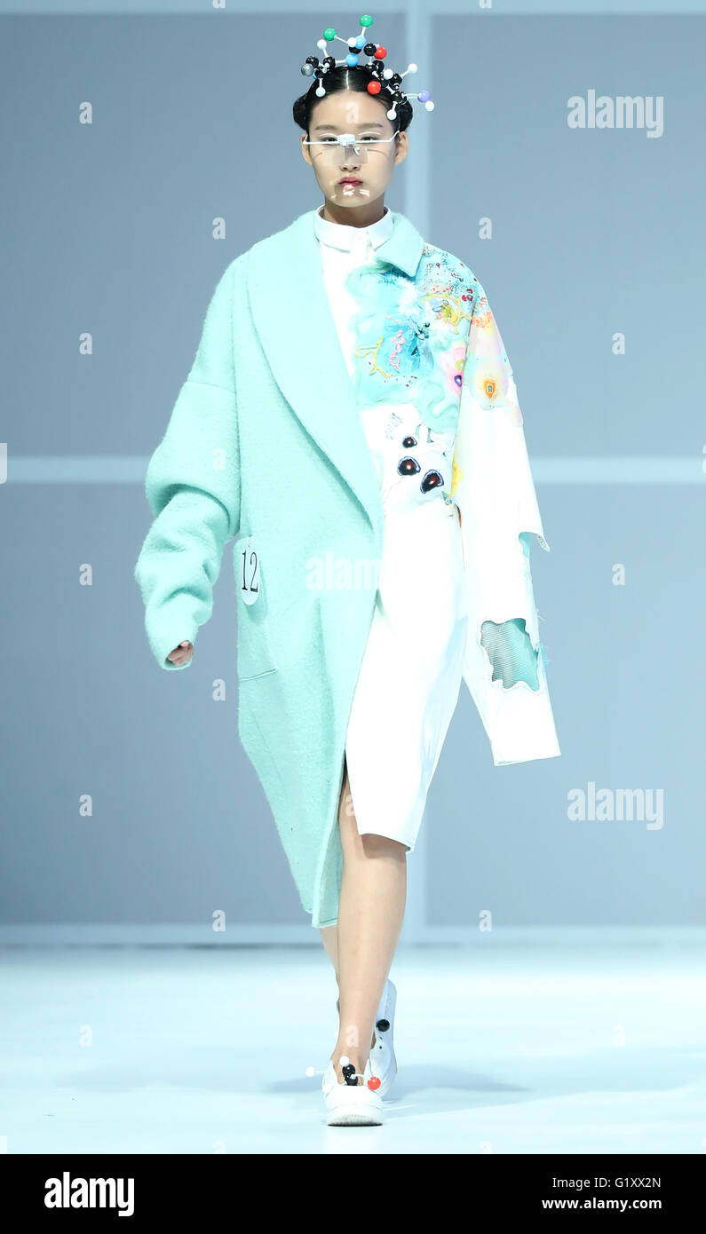 Beijing, China. 20th May, 2016. A model presents a creation at the 21st ...