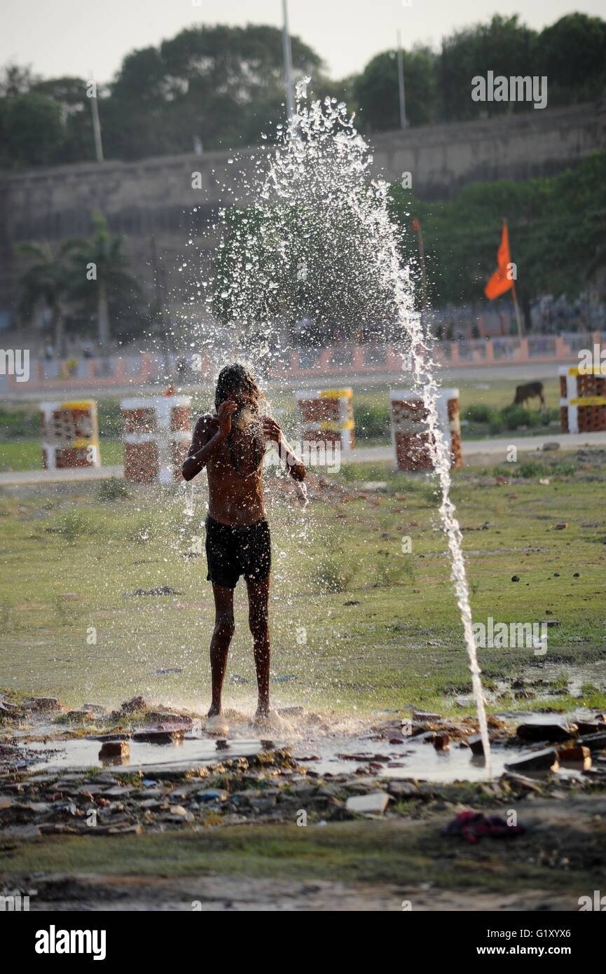 Allahabad, Uttar Pradesh, India. 20th May, 2016. A sadhu take bath from ...