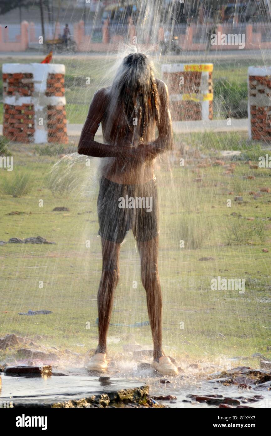 Allahabad, Uttar Pradesh, India. 20th May, 2016. A sadhu take bath from ...