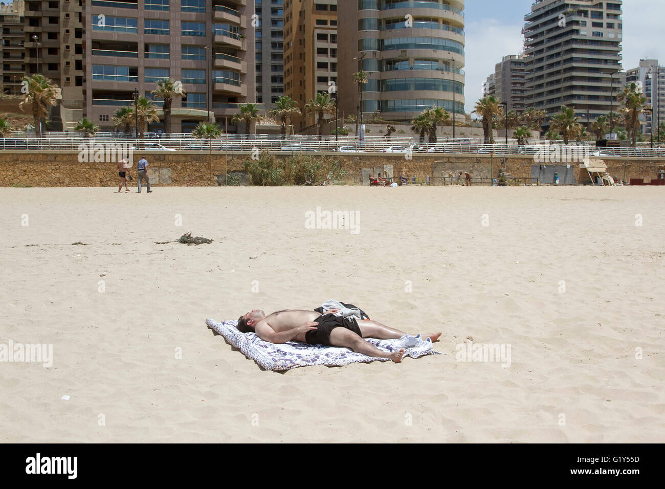 Beirut, Lebanon. 21st May, 2016. A Beachgoer soaks up the sun on a hot ...