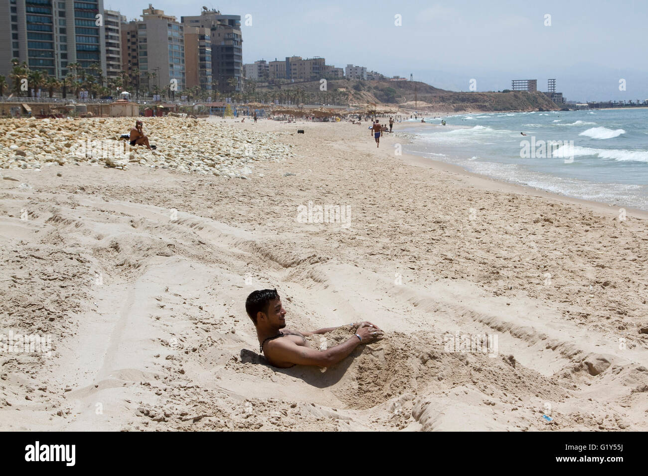 Beirut, Lebanon. 21st May, 2016. A Beachgoer soaks up the sun on a hot ...
