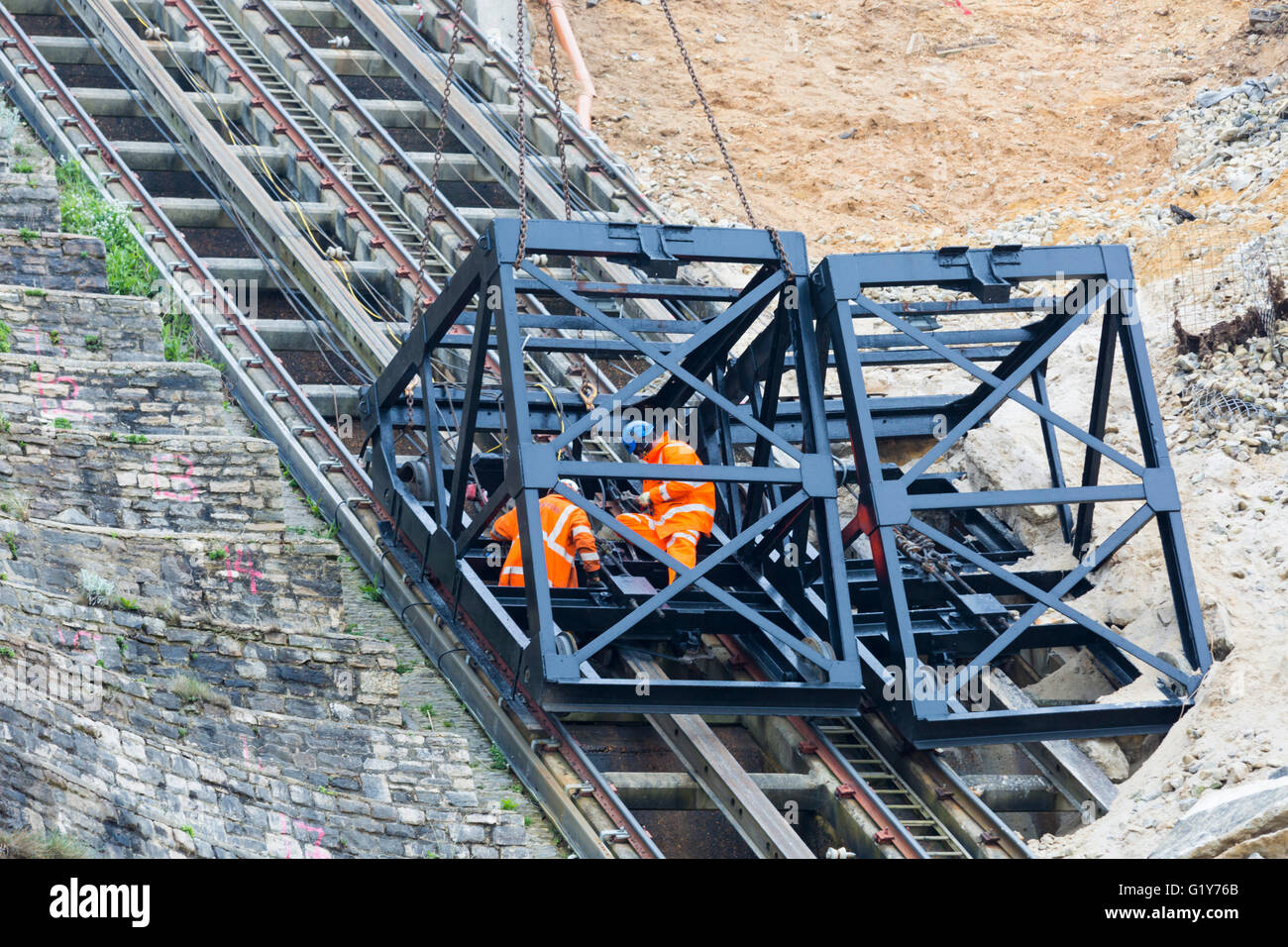 Crane lifting cage hi-res stock photography and images - Alamy