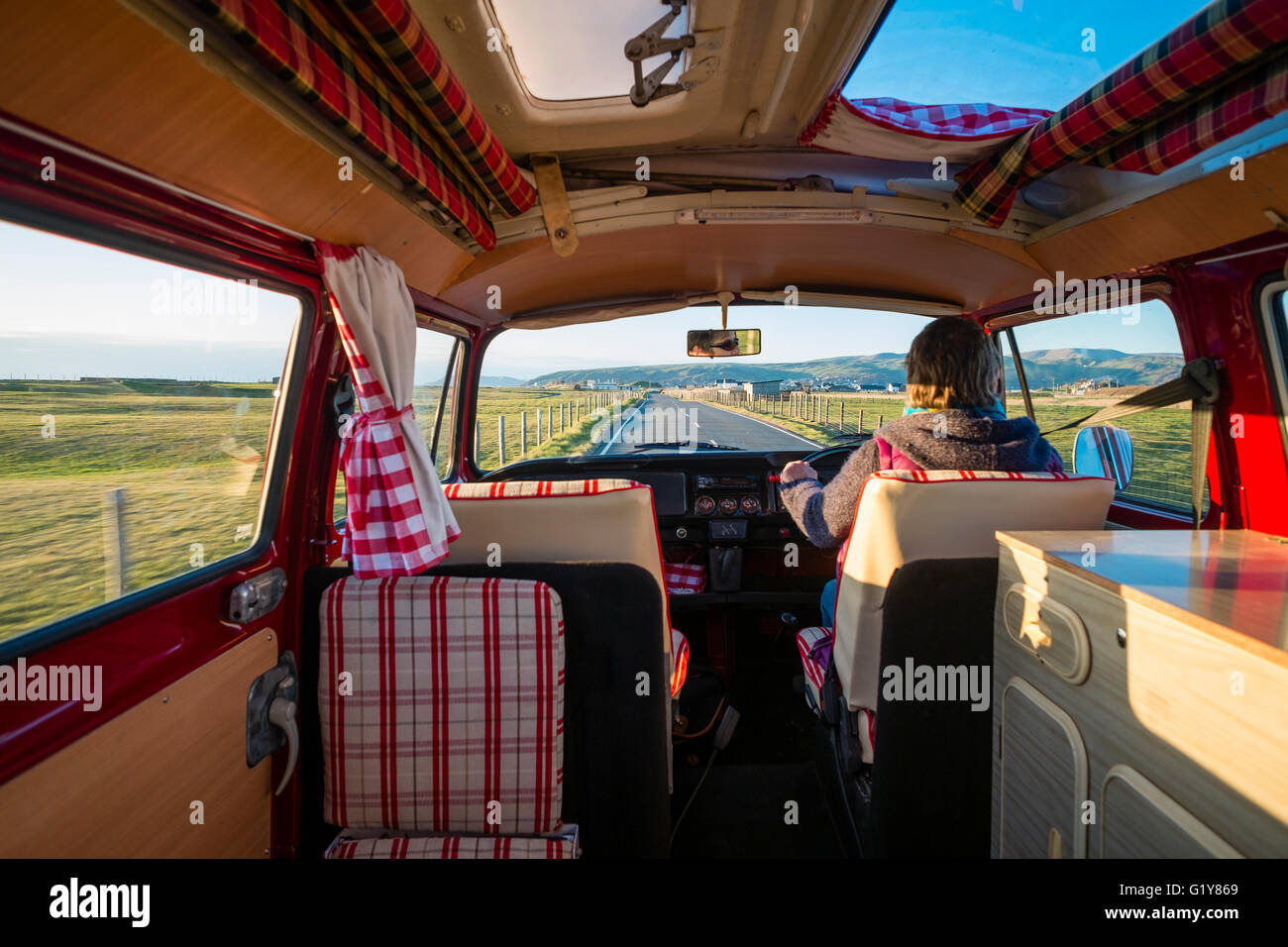 A woman owner driving her classic red 1972 Volkswagen VW T2 (type 2 ...