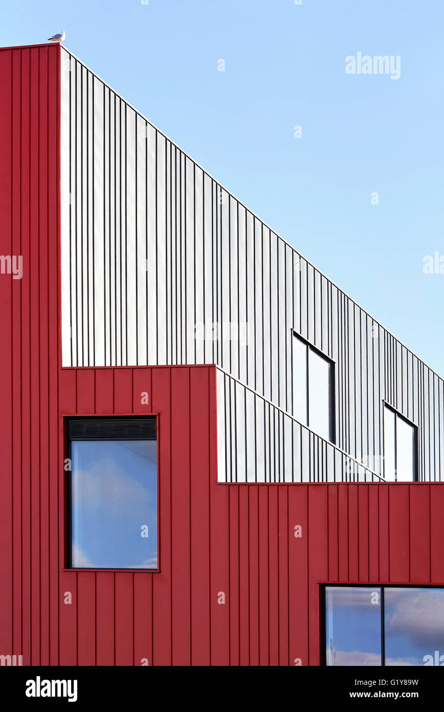 Grey and red steel cladding of exterior facade. Plymouth Creative ...