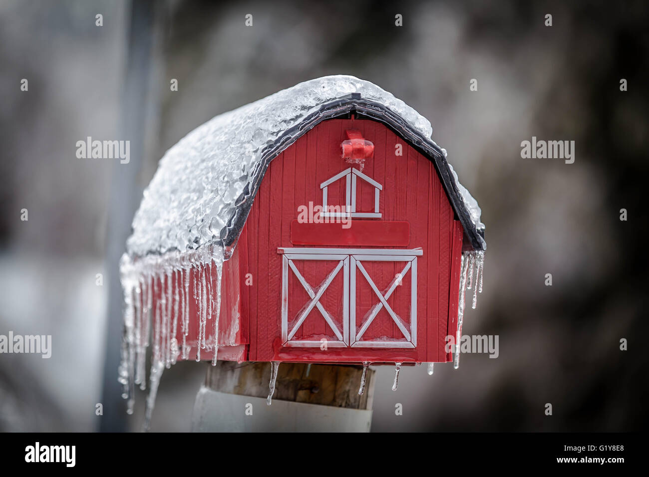 Icy Red Hut Mailbox Stock Photo - Alamy