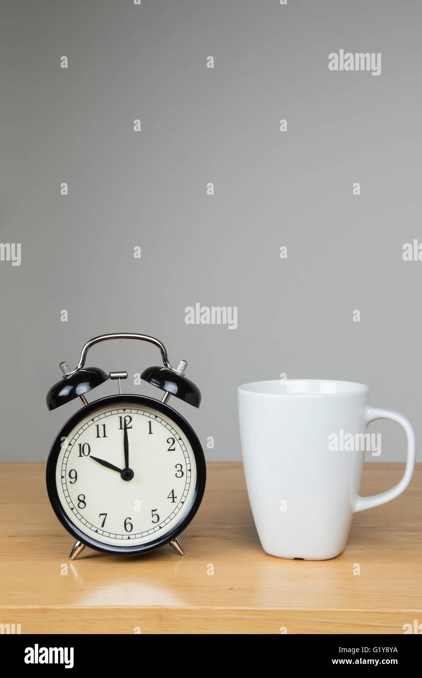 Cup of tea and alarm clock Stock Photo - Alamy