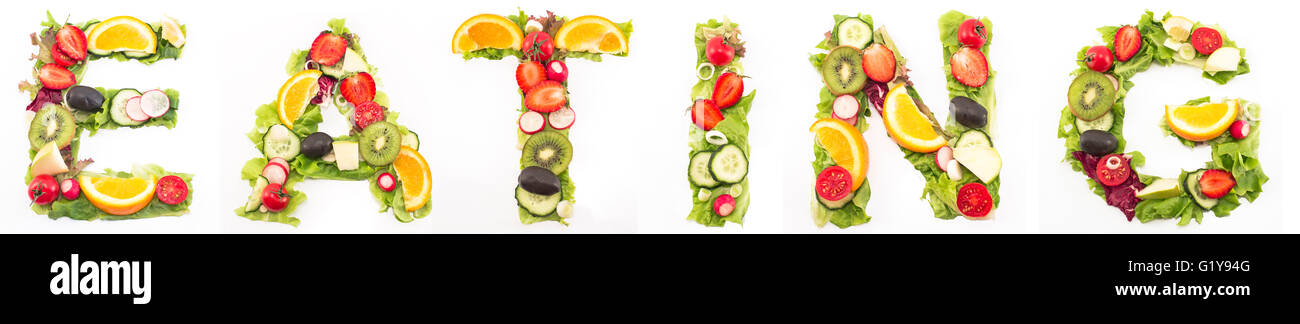 Word eating made of salad and fruits Stock Photo - Alamy