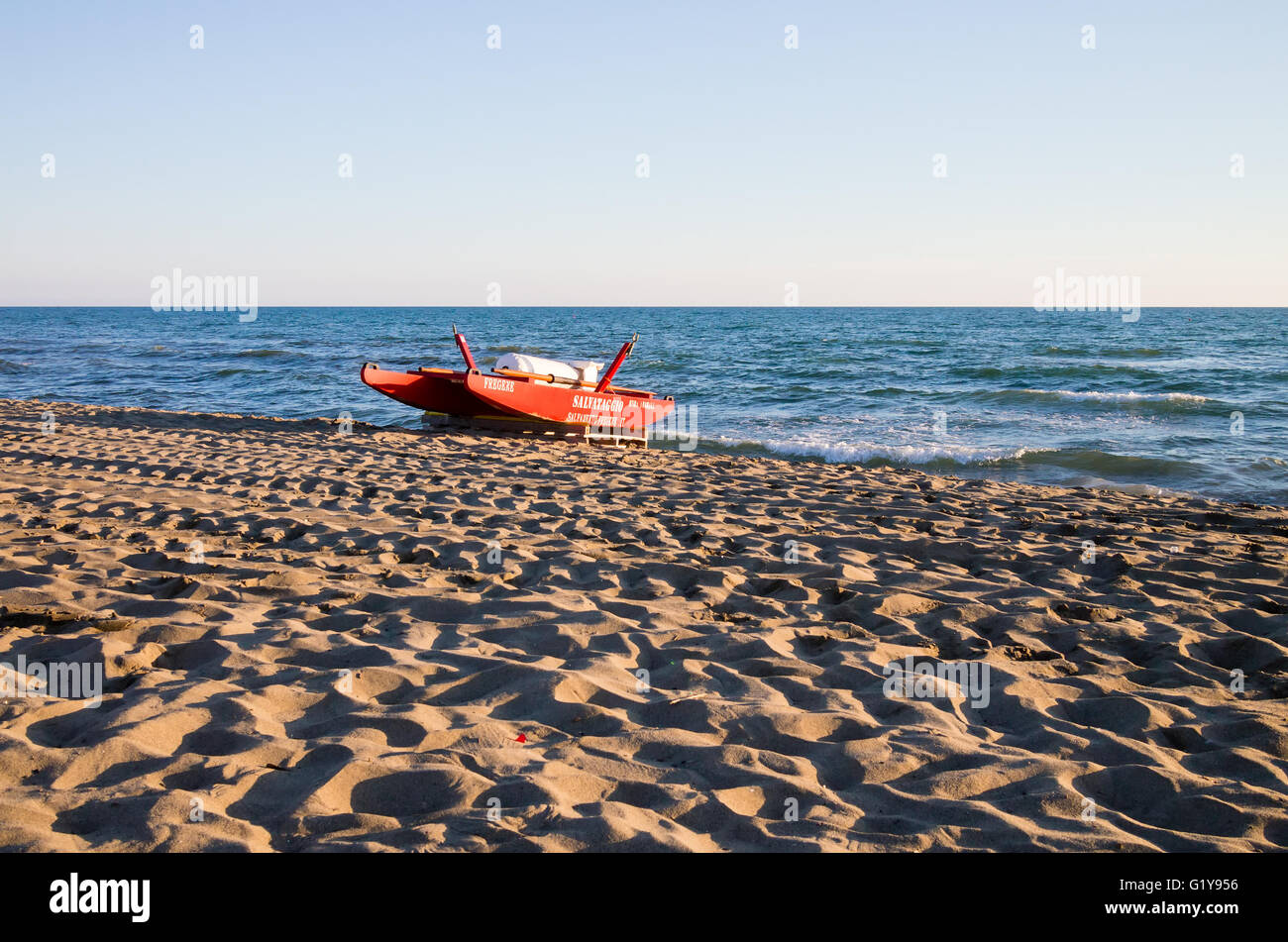 Red lifeguard boat on the beach Stock Photo - Alamy
