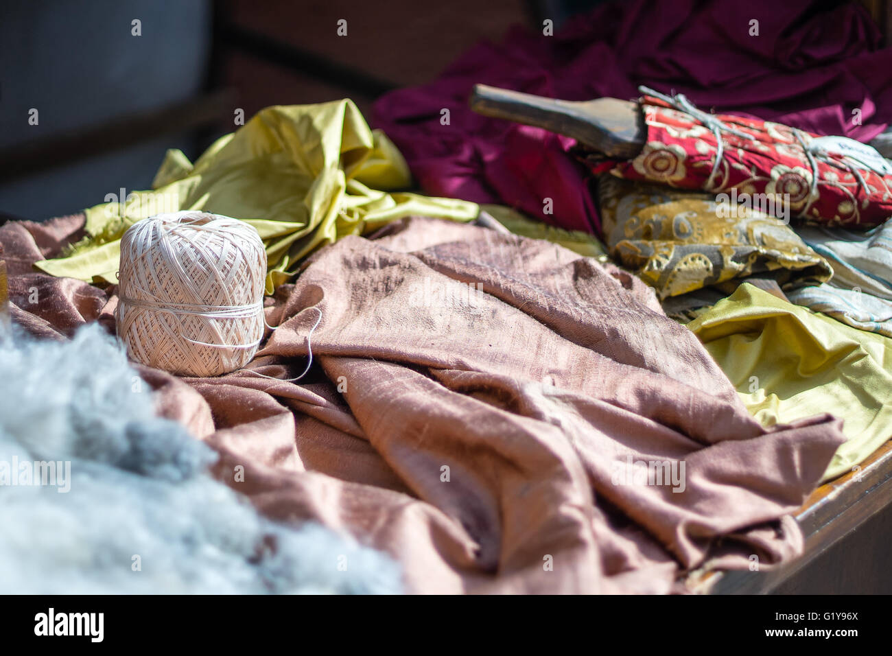 Sewing equipment and cloth in medieval style Stock Photo - Alamy