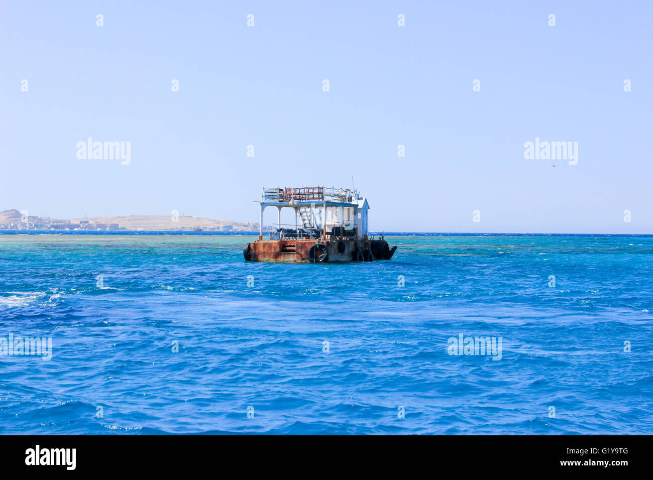 Old Rusty Barge floating on the Sea Stock Photo - Alamy