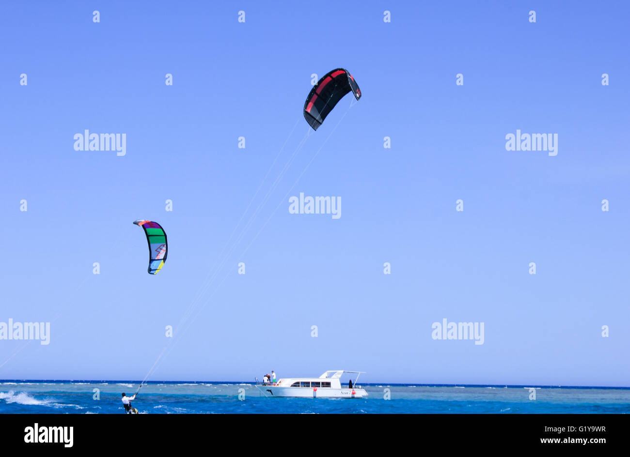 Parasail on blue sky Stock Photo - Alamy