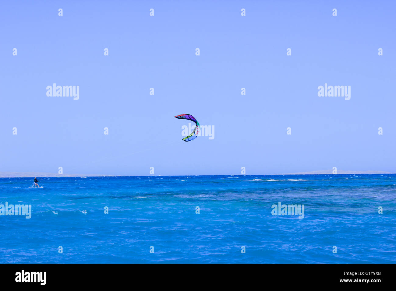 Parasail on blue sky Stock Photo - Alamy