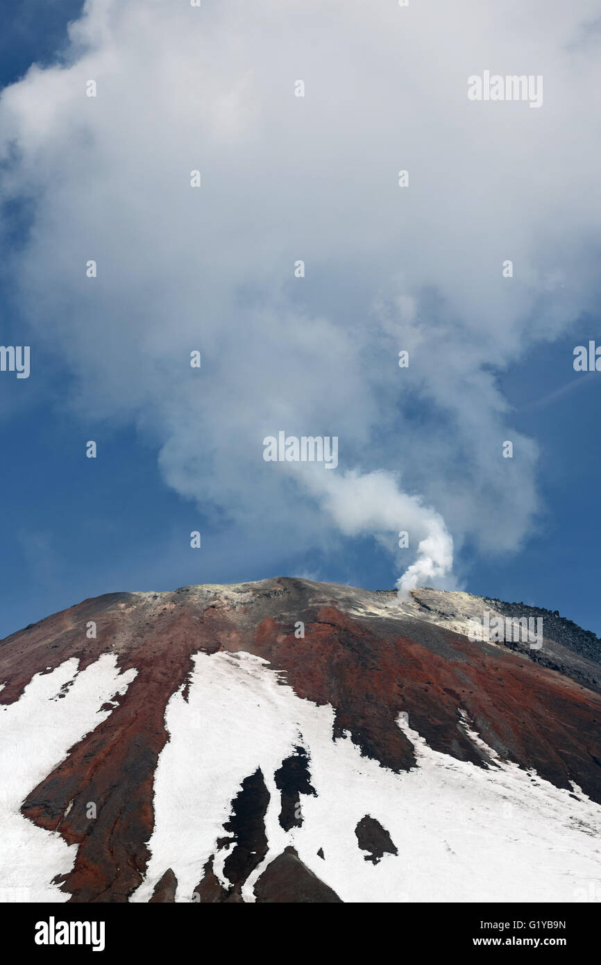 View of top of volcanic cone, fumarolic activity of volcano - steam and ...