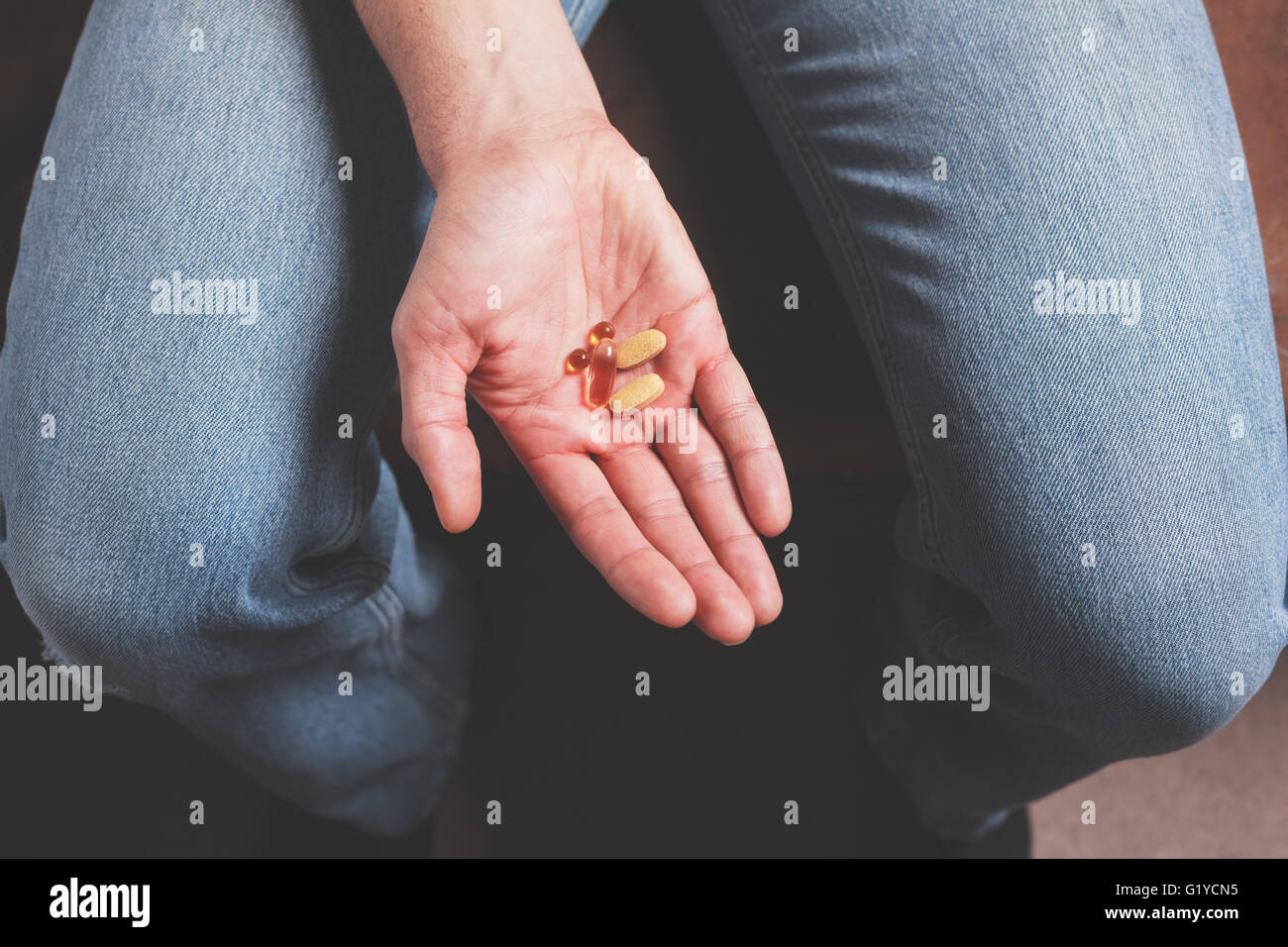Man holding a pill hi-res stock photography and images - Alamy