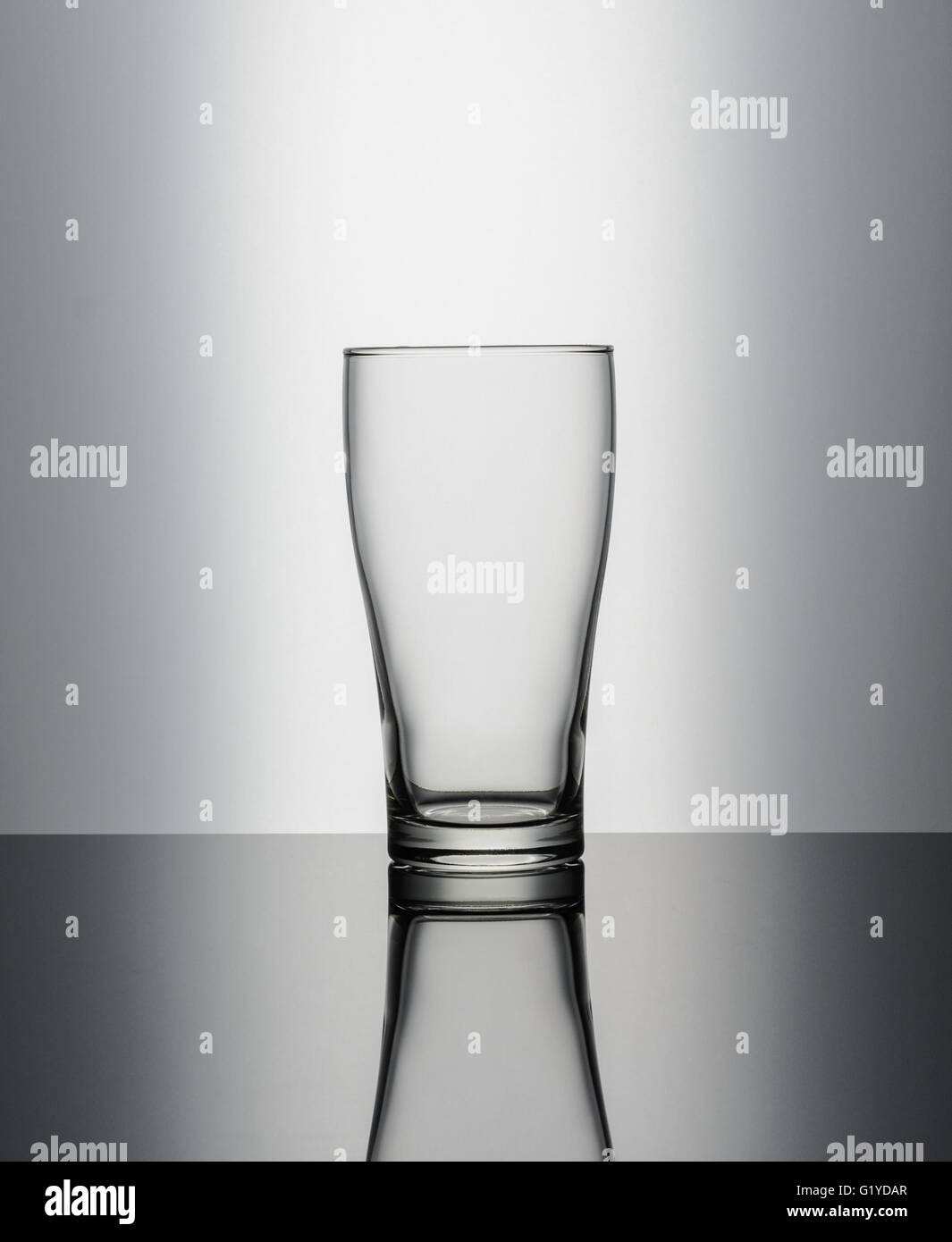 Empty glass on glass table Stock Photo - Alamy