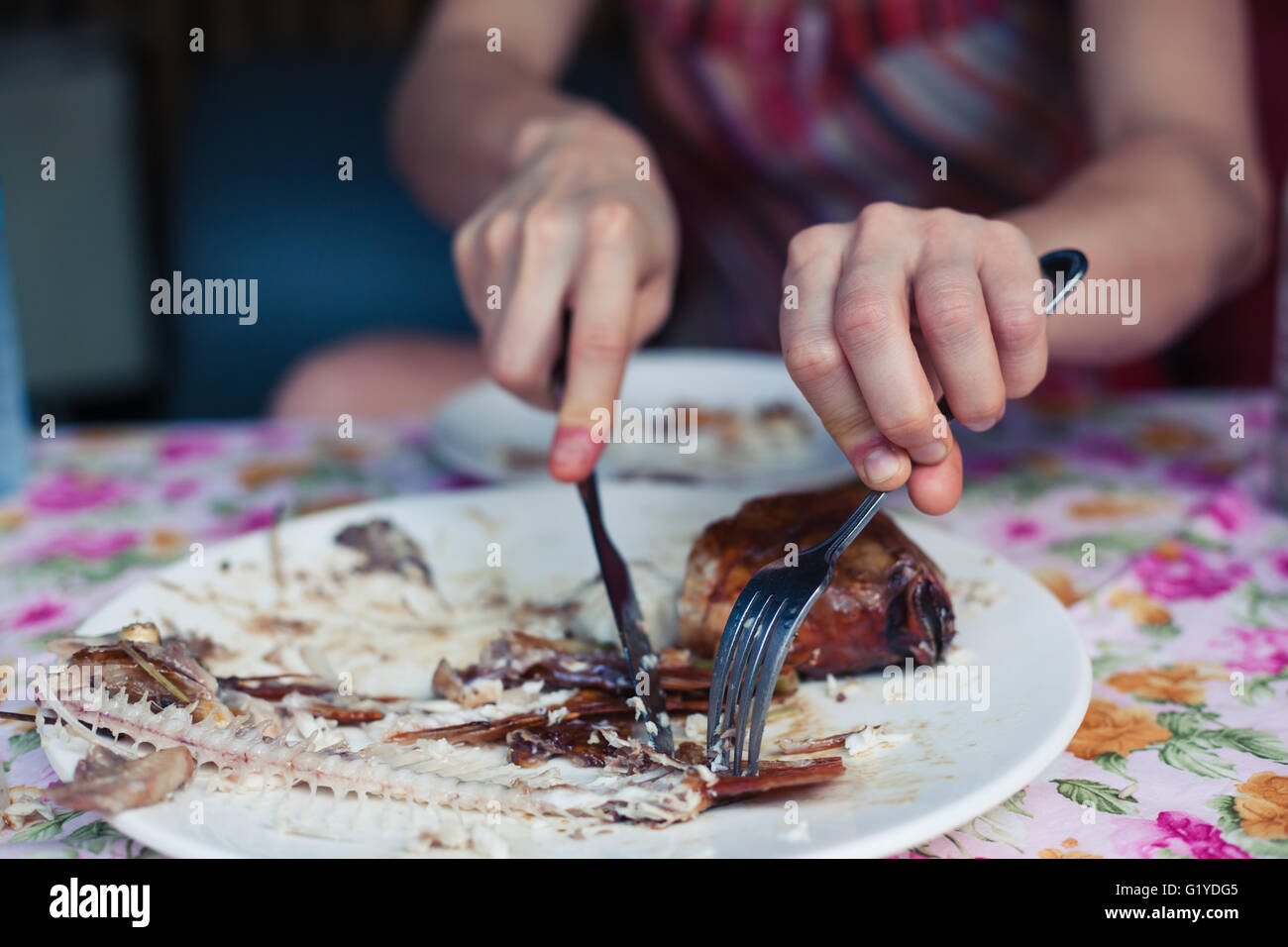 Female cutting fish knife in hi-res stock photography and images - Alamy