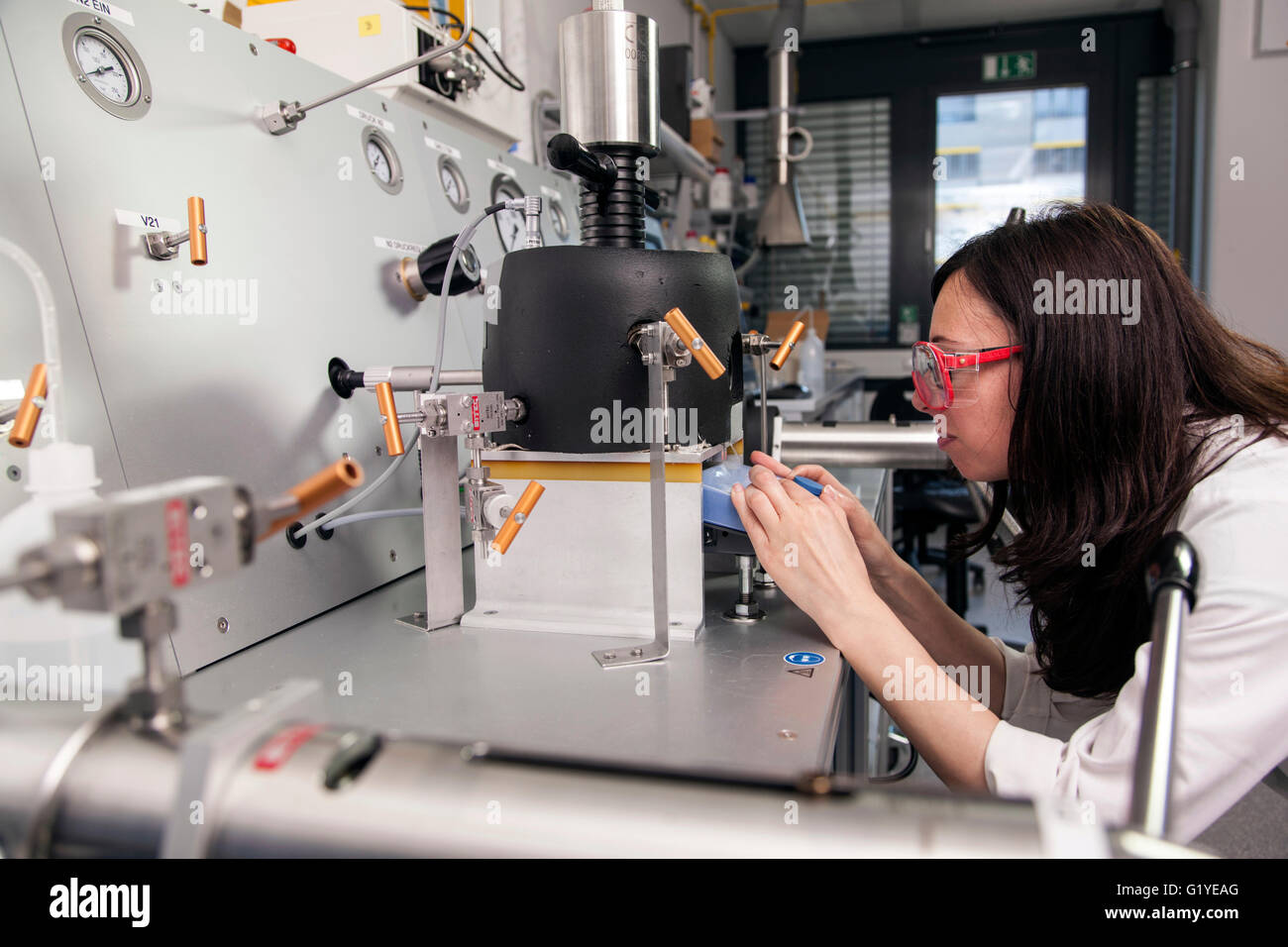 Geologist at the high-pressure apparatus in the laboratory Stock Photo ...